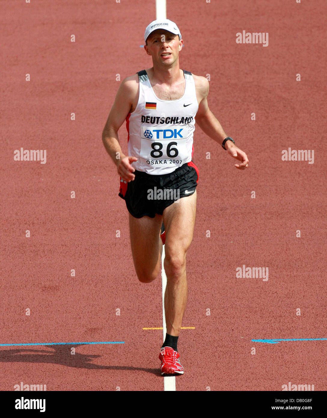 German Ulrich Steidl runs the last few metres to finish the Marathon of ...
