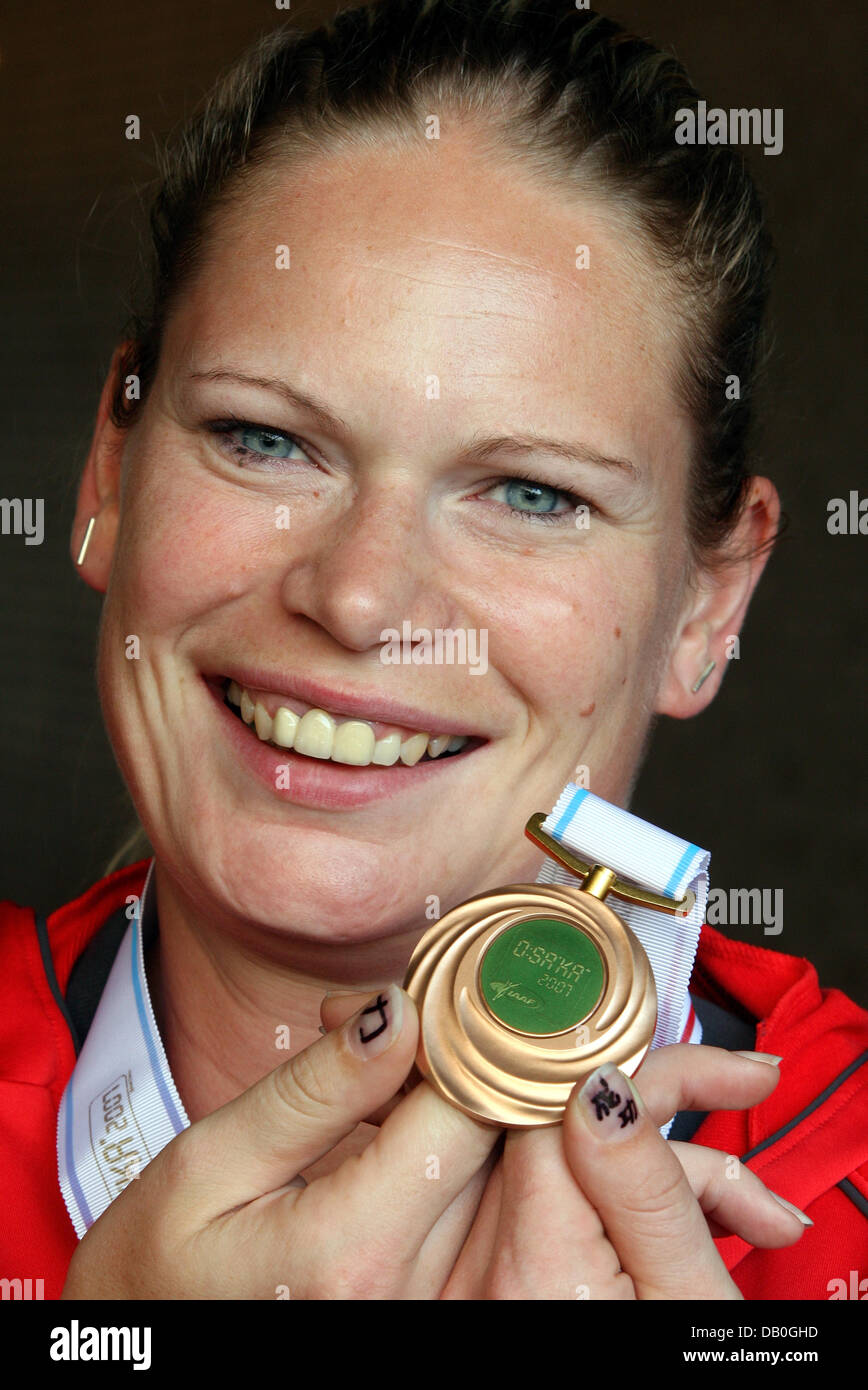 German shot-putter Nadine Kleinert presents her bronze medal which she ...