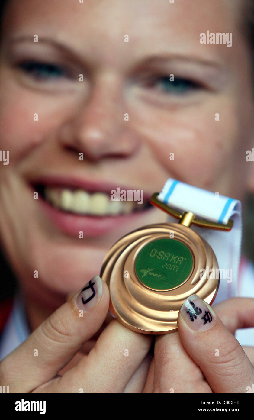 German shot-putter Nadine Kleinert presents her bronze medal which she ...