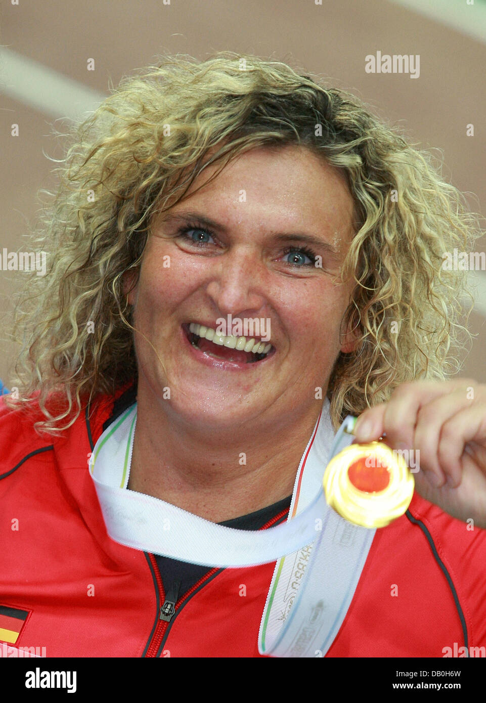 German Franka Dietzsch poses with her gold medal after her victory in ...