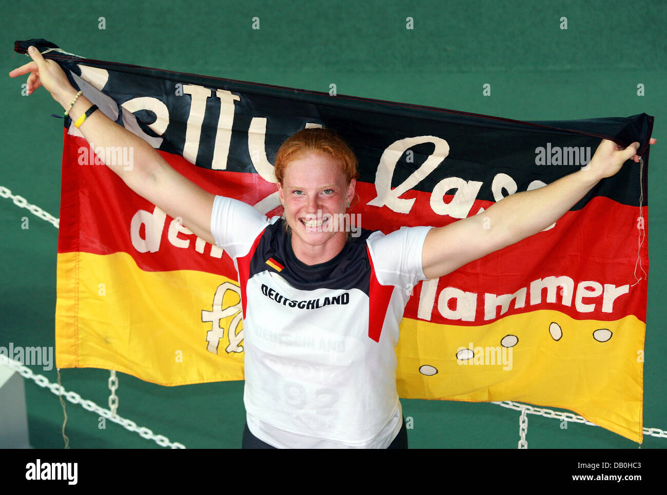 German hammer thrower Betty Heidler celebrates with a German flag after ...