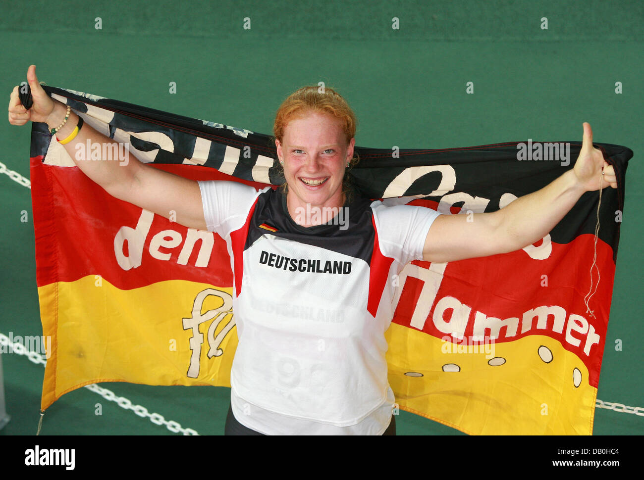 German hammer thrower Betty Heidler celebrates with a German flag after ...