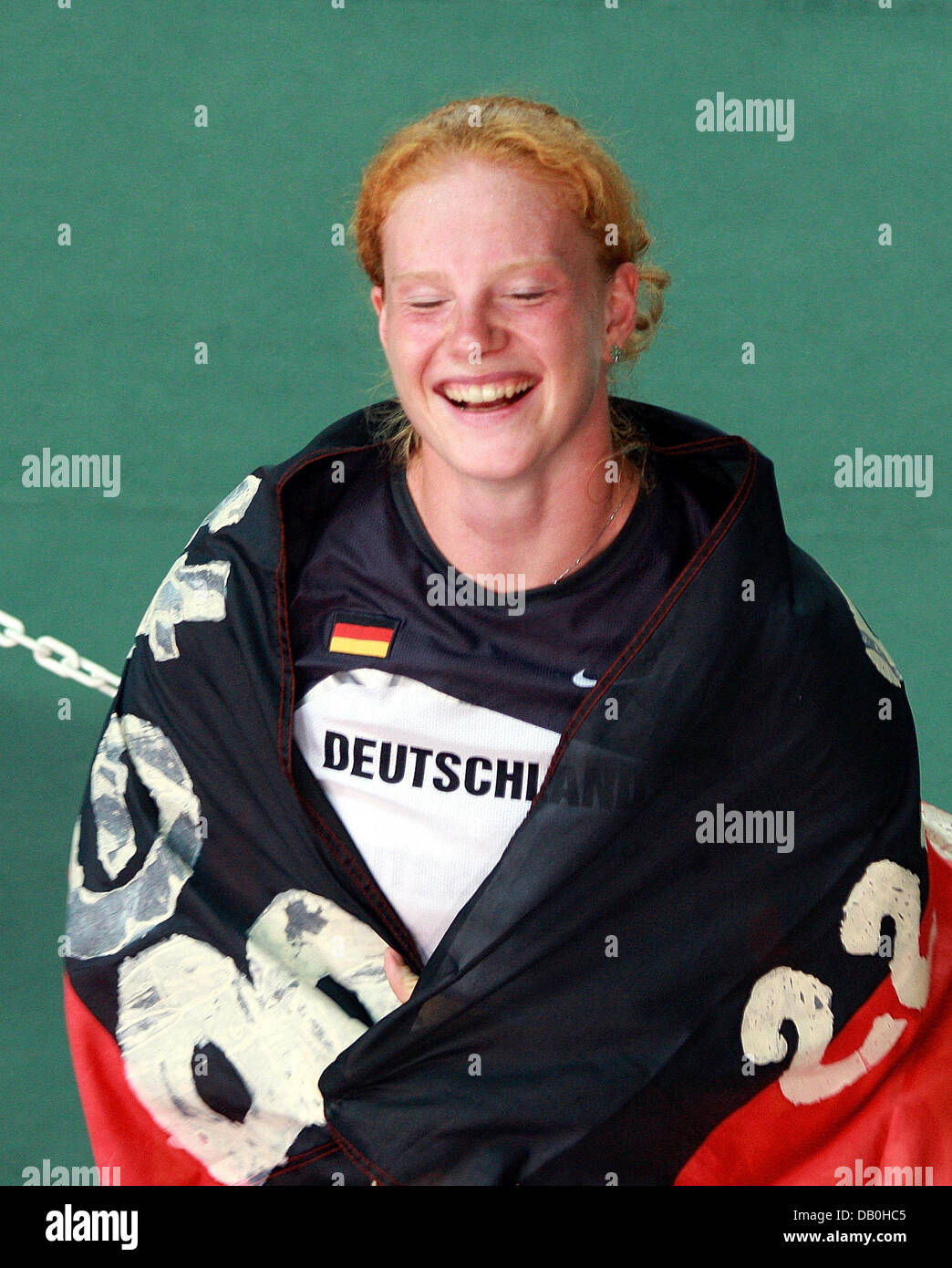 German hammer thrower Betty Heidler celebrates with a German flag after ...