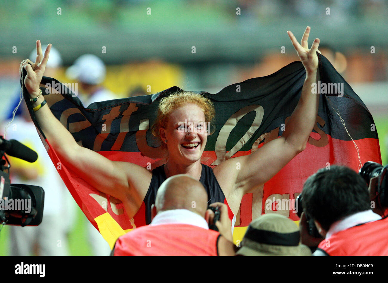 German hammer thrower Betty Heidler celebrates with a German flag after ...
