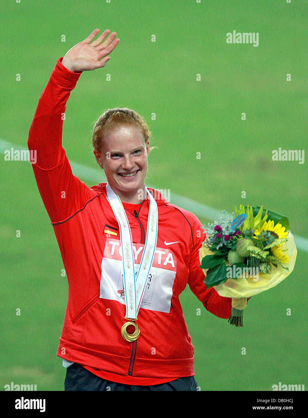 German hammer thrower and gold medal winner Betty Heidler greets the ...