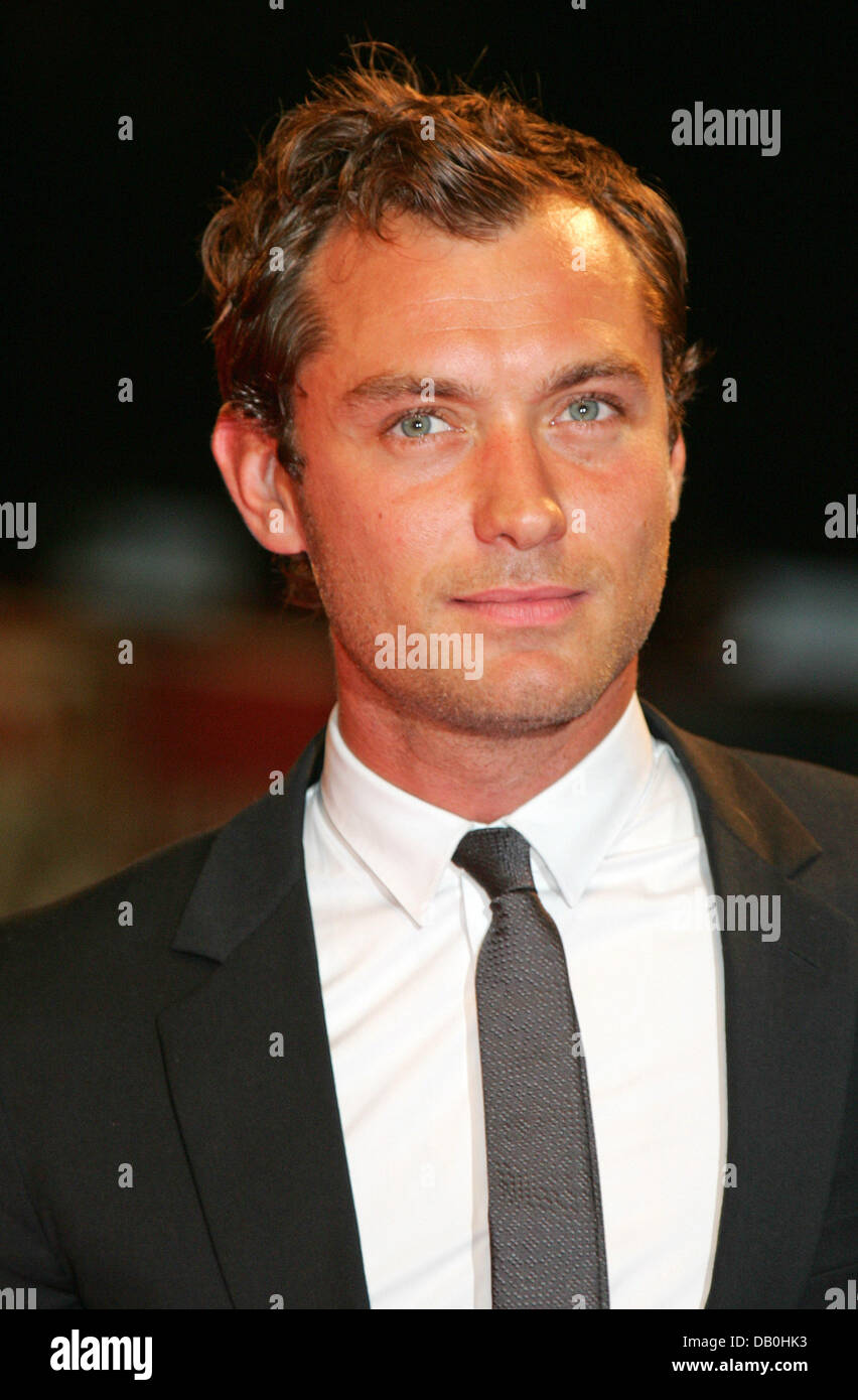 British actor Jude Law smiles for the cameras as he arrives for the ...