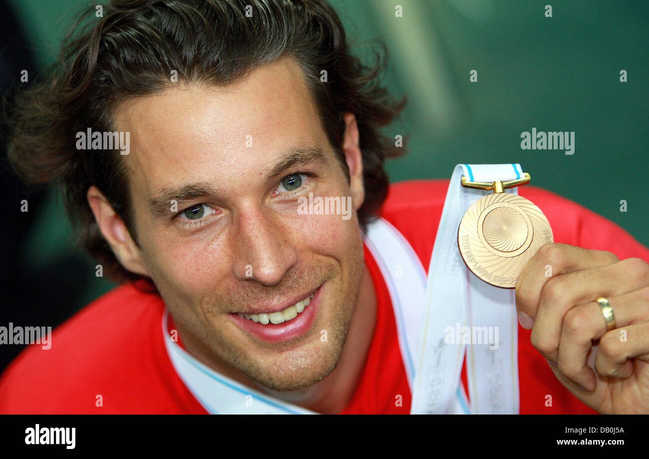 German Danny Ecker poses with his bronze medal won in the Pole Vault ...