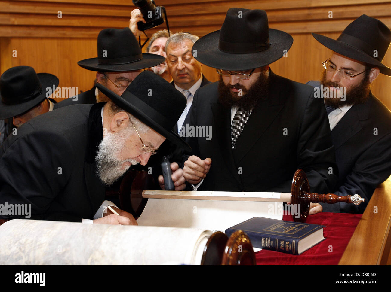Rabbis sign the Thora scroll during the opening and inauguration of ...