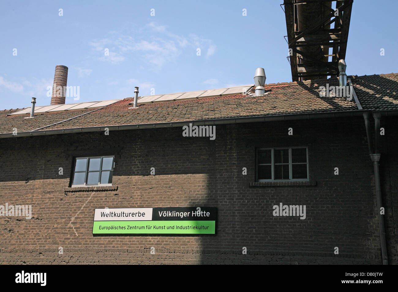 The photo shows a building with a green sign reading 'Weltkulturerbe ...
