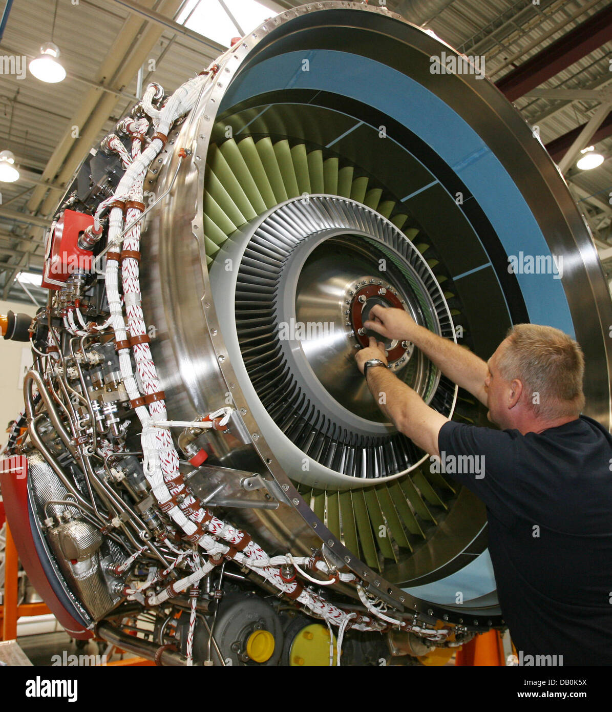 A technician checks an engine V 2500-A5 of the Airbus series A 318-20 ...