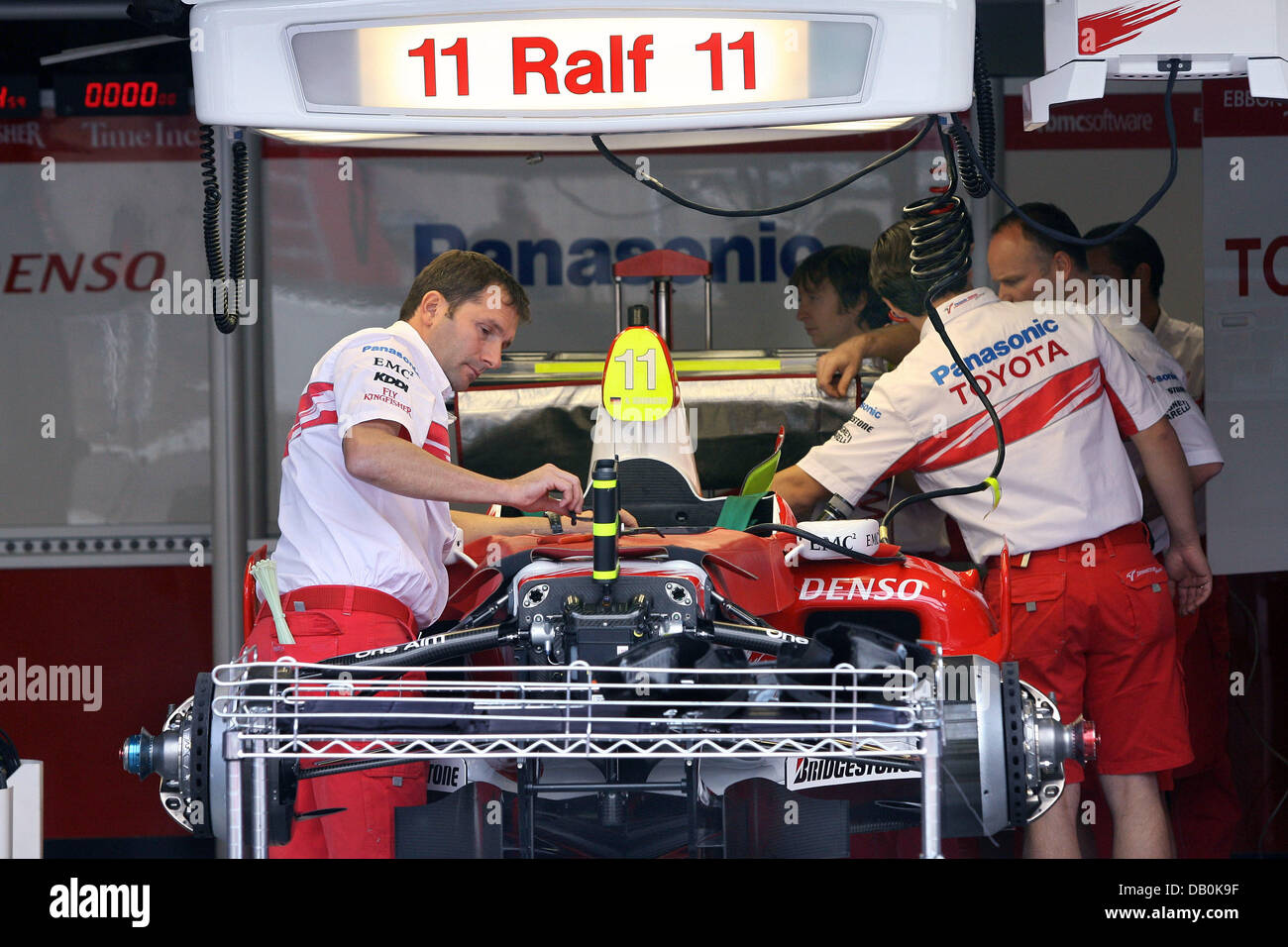 Toyota mechanics work on a Formula One Car at the Italian Formula One ...
