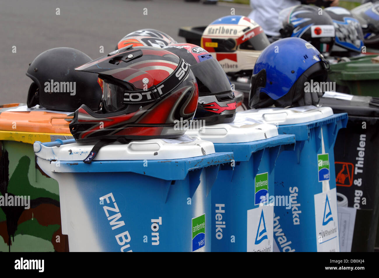 Customary dustbins and helmets are lined up prior to the third dustbin ...