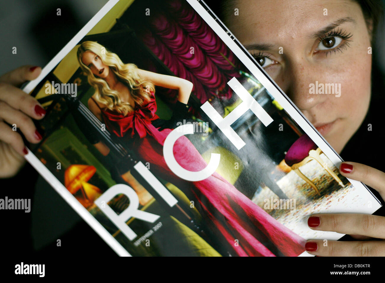A woman holds the new luxury magazine 'Rich' in her hands in Nuremberg ...