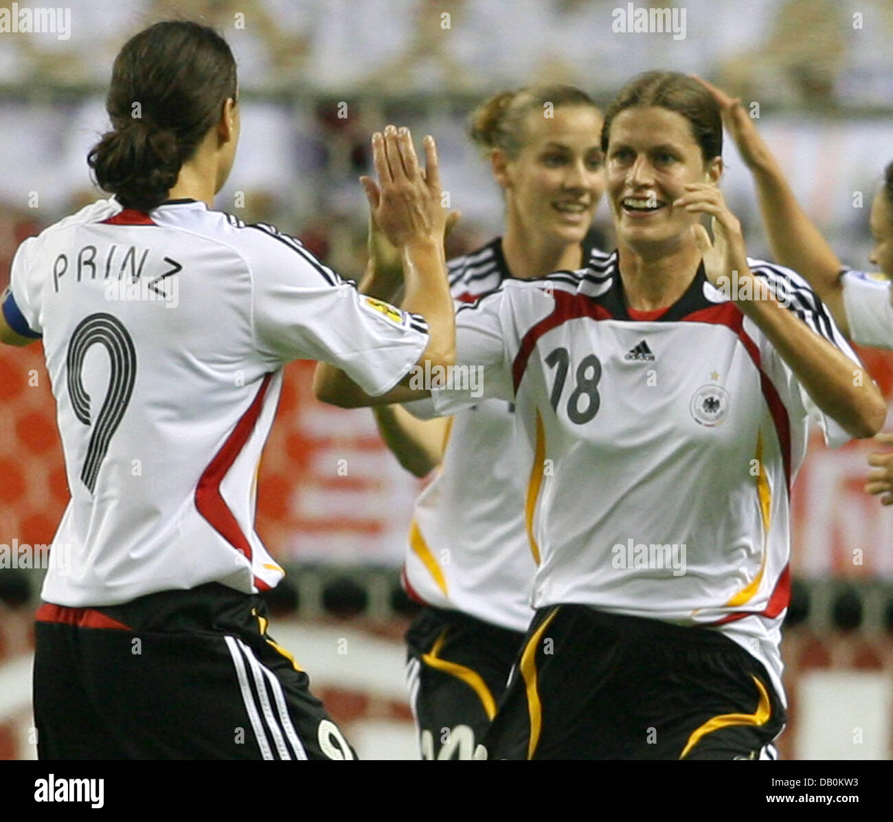 German Birgit Prinz (L) celebrates with Kerstin Garefrekes (R) who ...