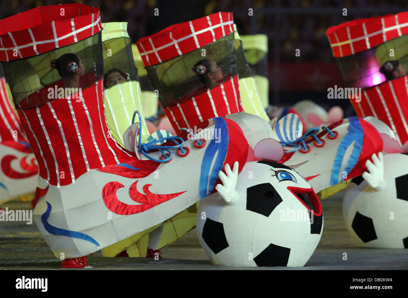 Young girls in elaborate costumes perform during the opening ceremony ...