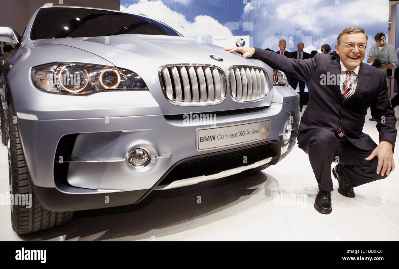 CEO of BMW Norbert Reithofer poses with the BMW Concept X6 Active ...