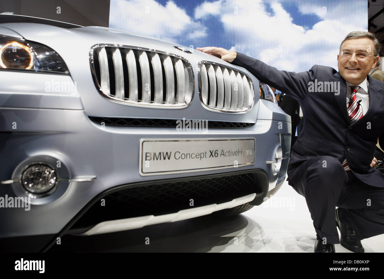 CEO of BMW Norbert Reithofer poses with the BMW Concept X6 Active ...
