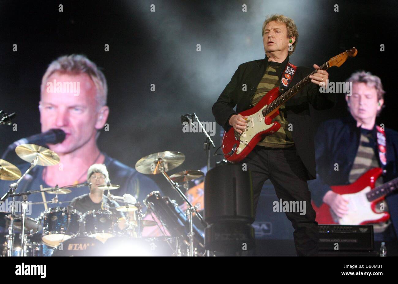 Guitarrist Andy Summers (C) of the rock band 'The Police' performs ...