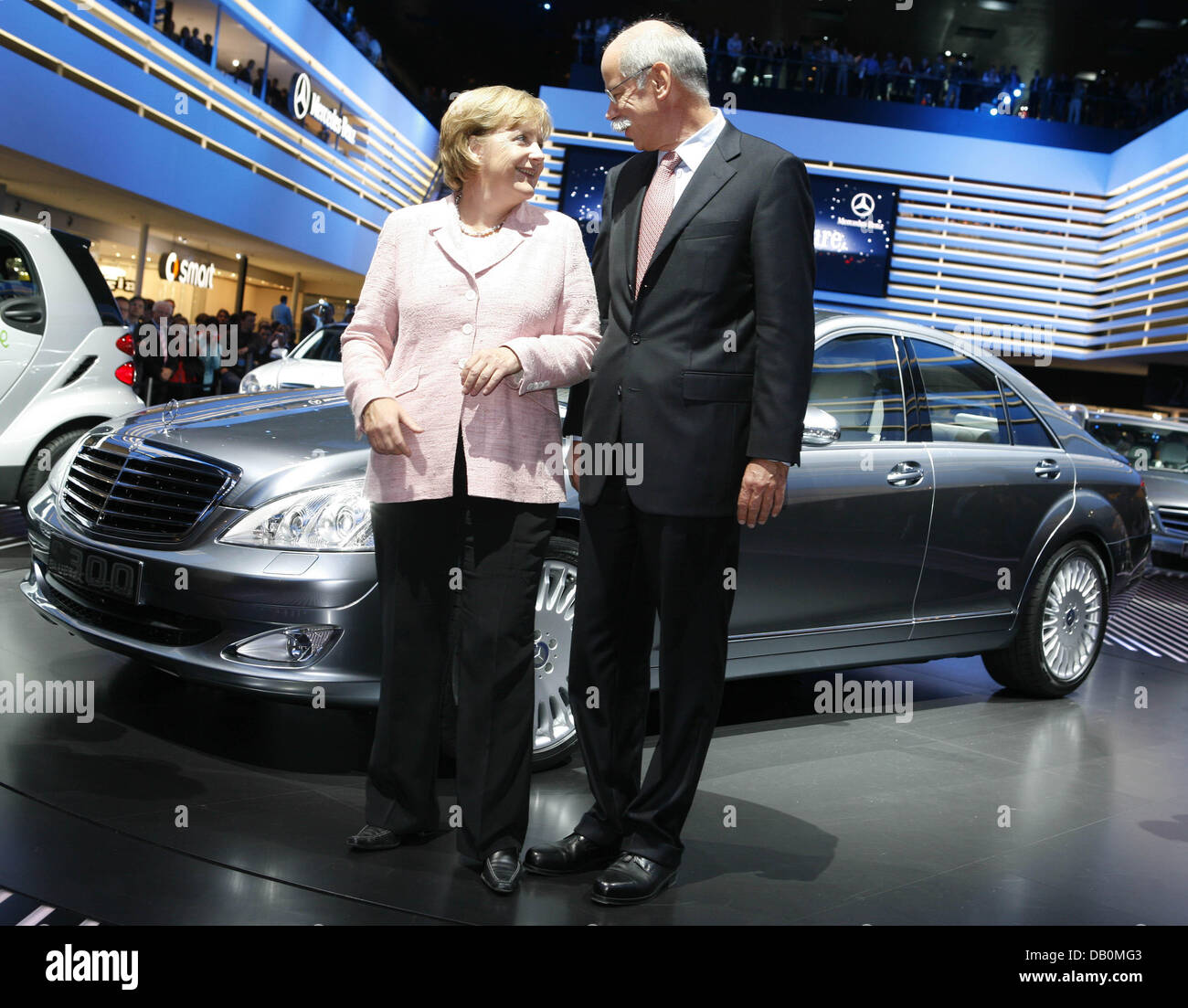 German Chancellor Angela Merkel (L) and Daimler CEO Dieter Zetsche talk ...