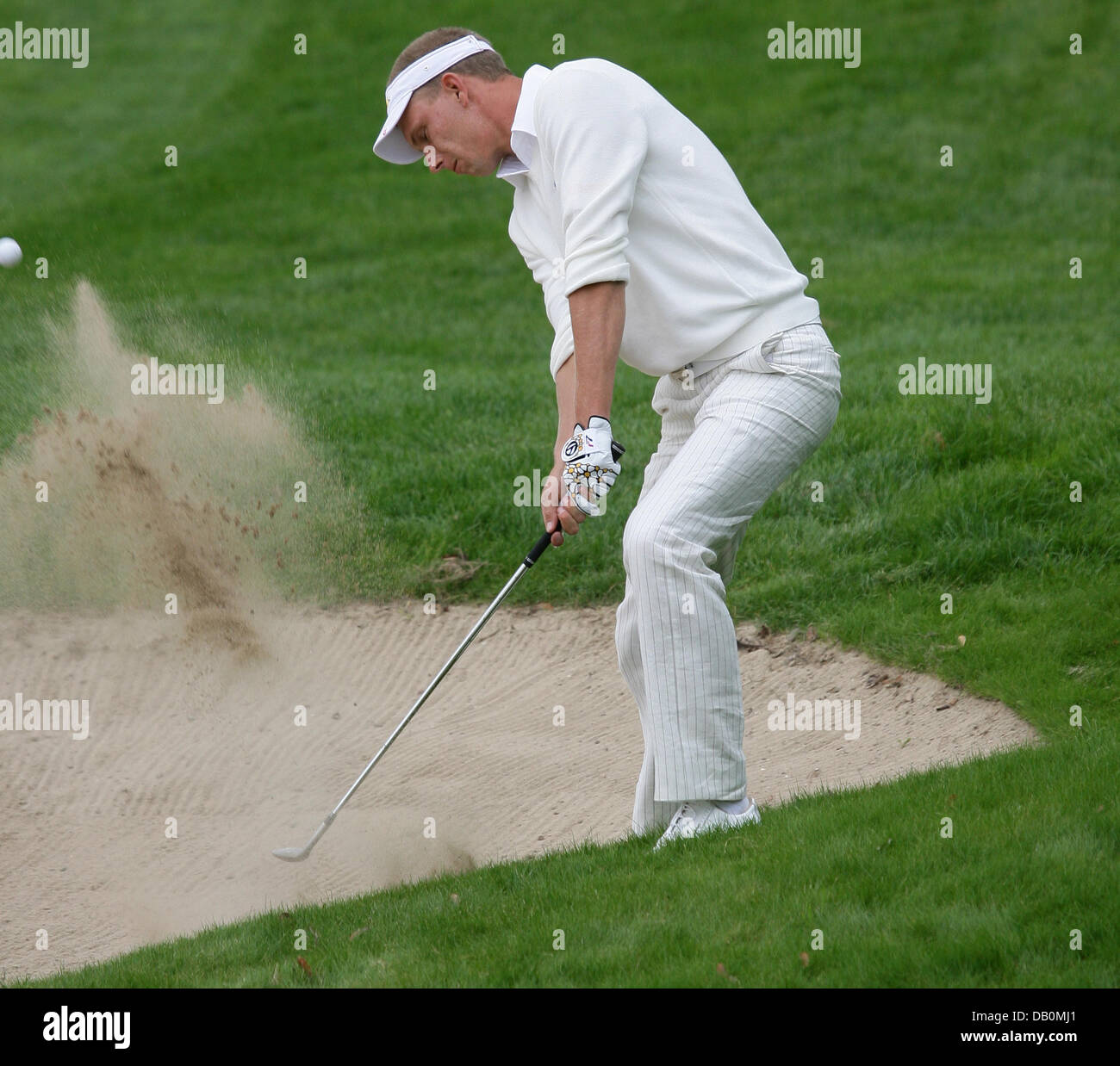 German golfer Marcel Siem plays the ball from the bunker at the ...