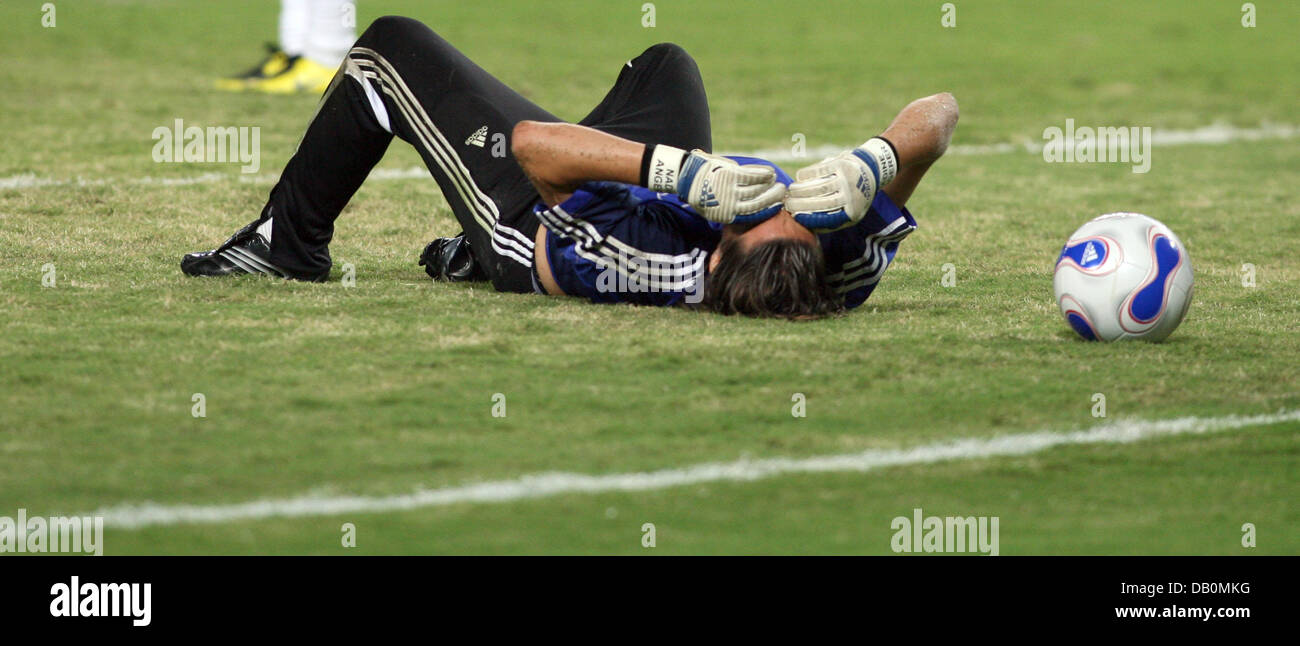 Germany's national soccer goal keeper Nadine Angerer lies on the pitch ...