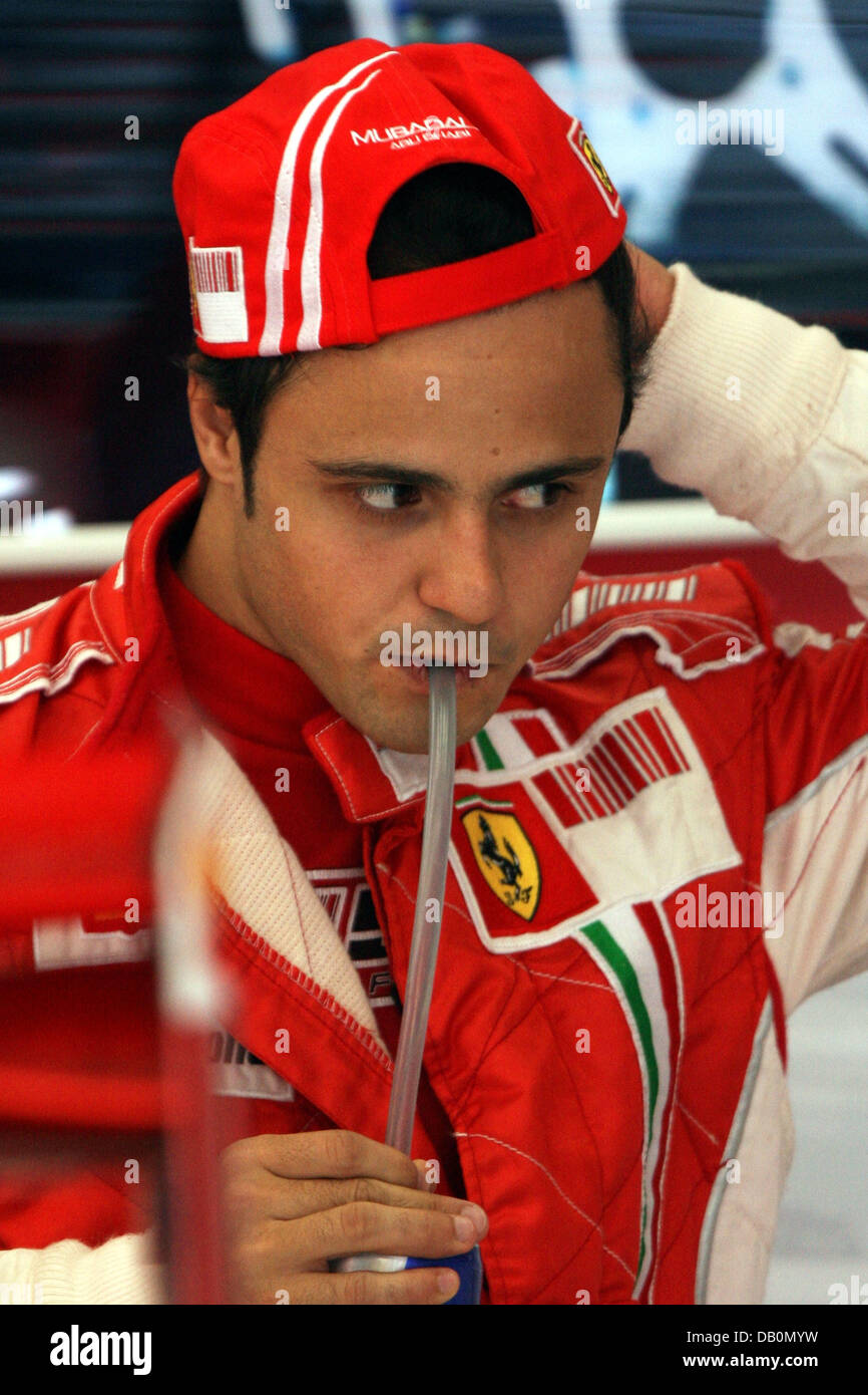 Brazilian Formula One driver Felipe Massa of Ferrari drinks water ...