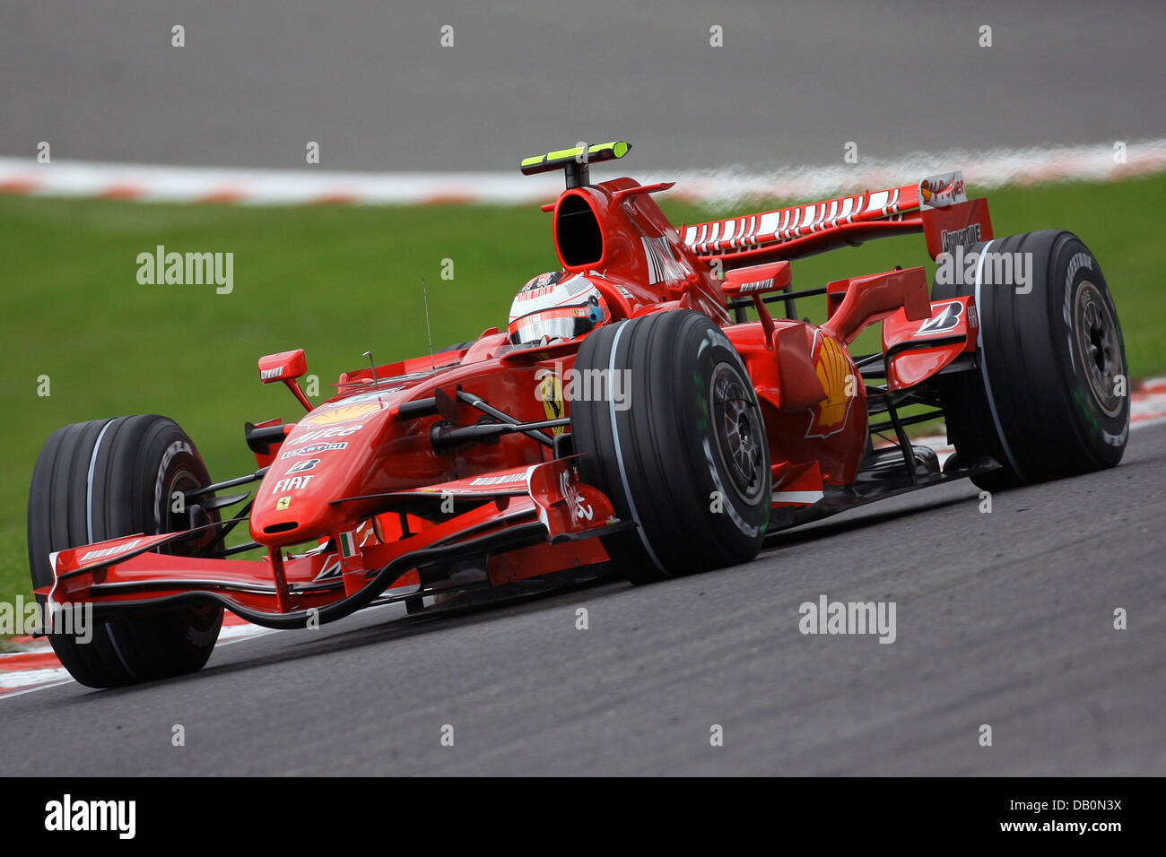 Finnish Formula One pilot Kimi Raikkonen of Ferrari steers his car ...