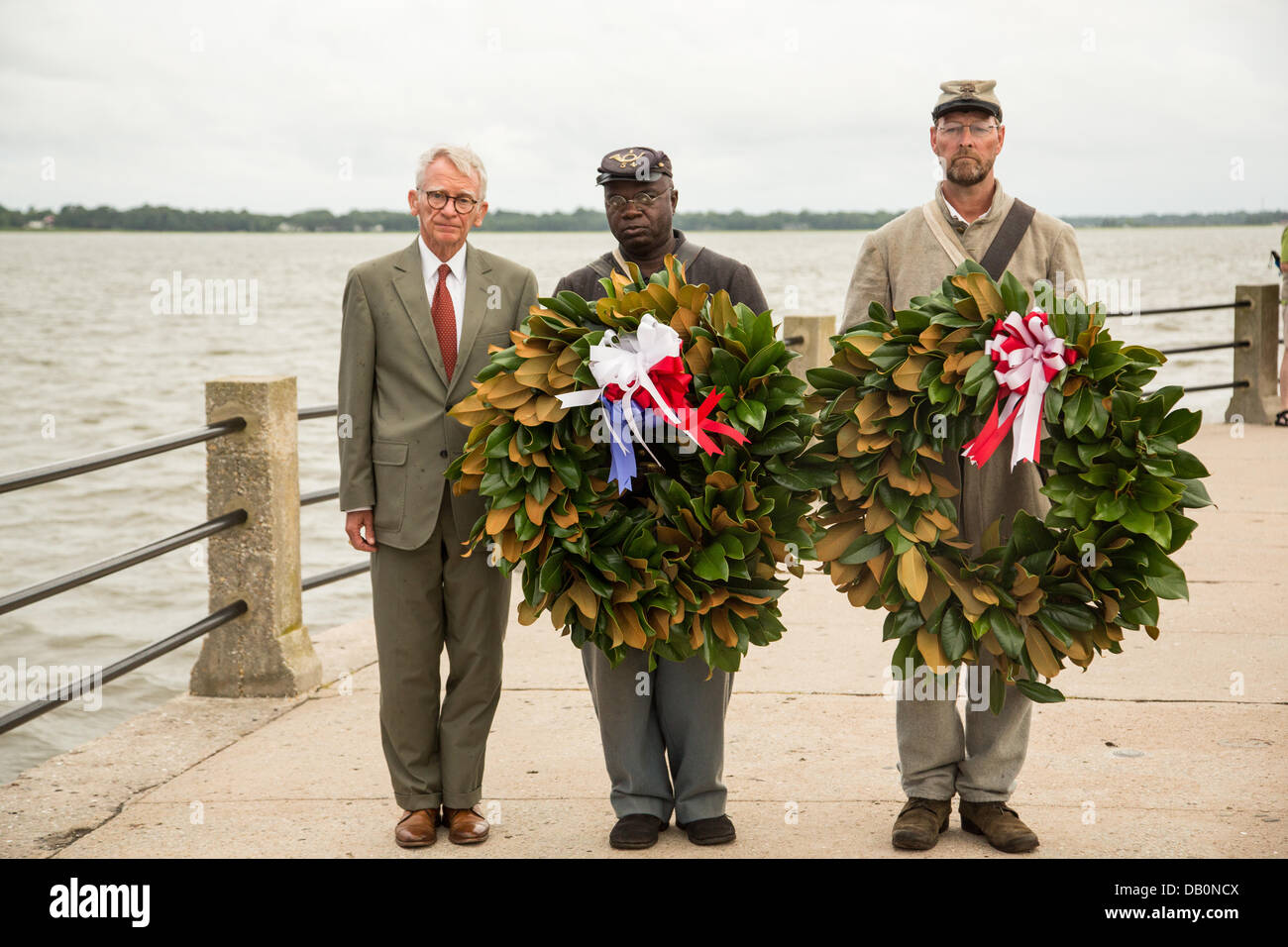 Charleston Mayor Joe Riley prepares to lay during a ceremony unveiling ...