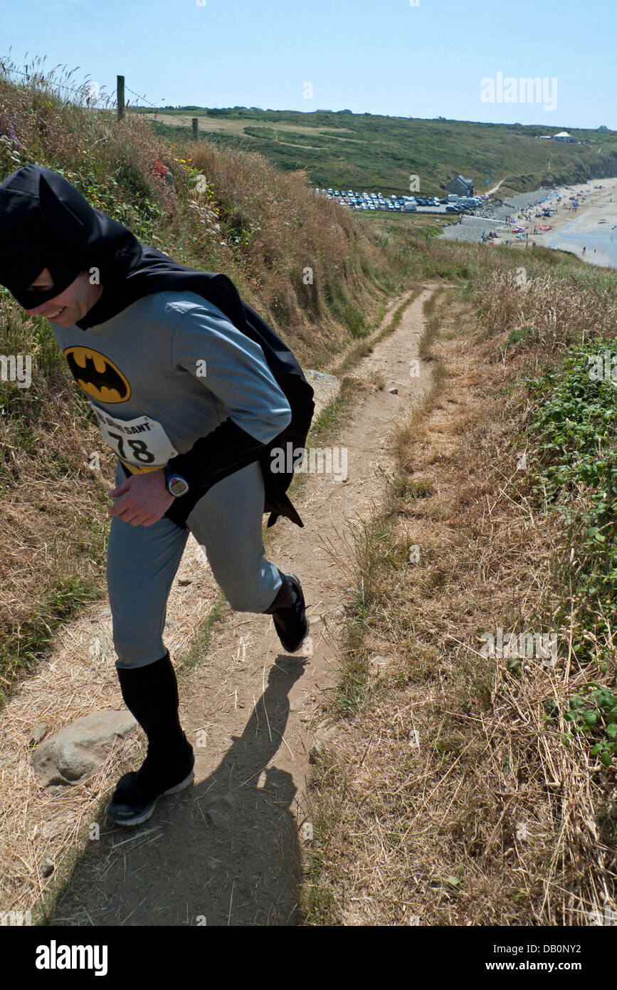 Man wearing Batman outfit on competitor running on the Pembrokeshire ...