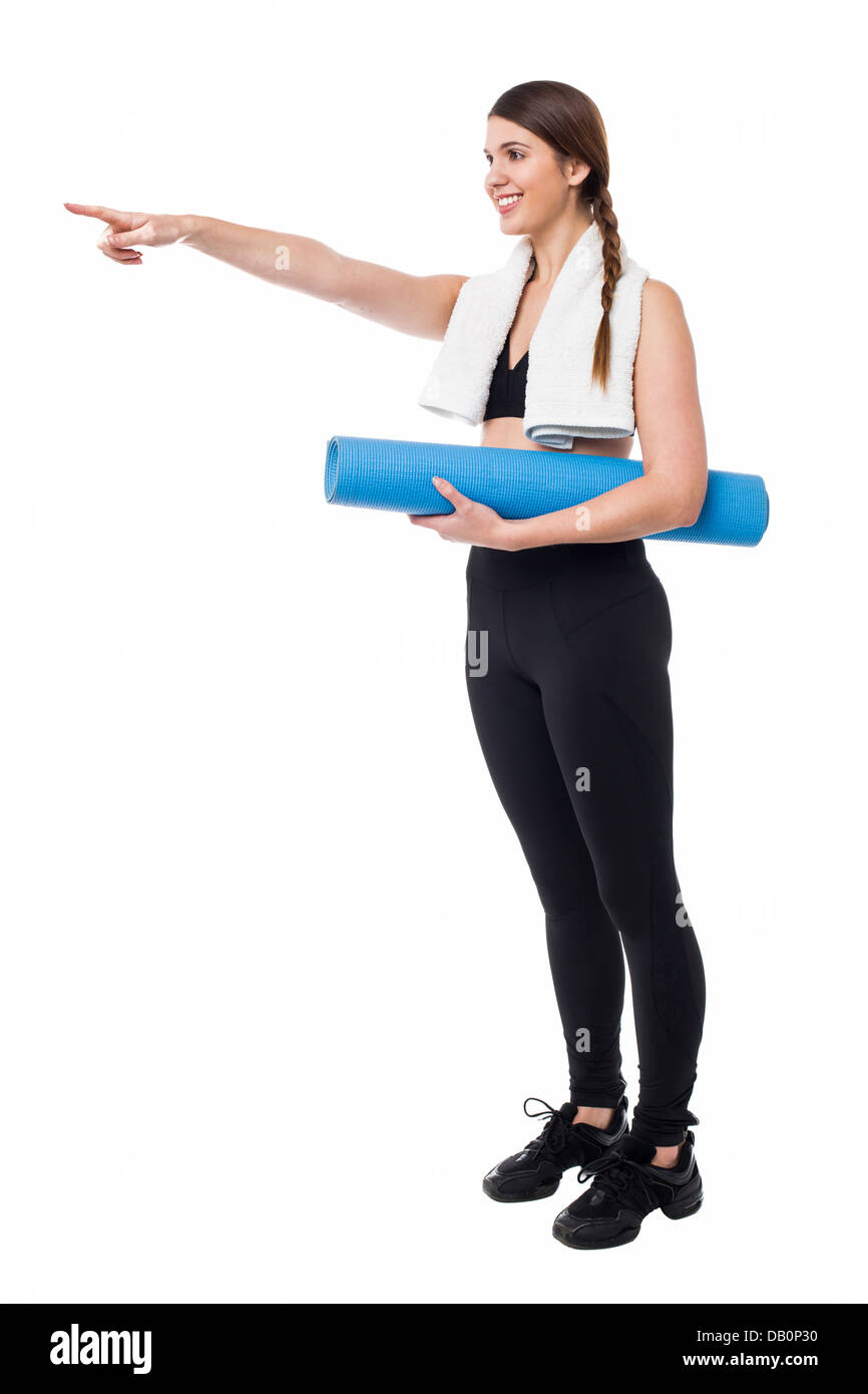 Pretty gym woman pointing forward Stock Photo - Alamy