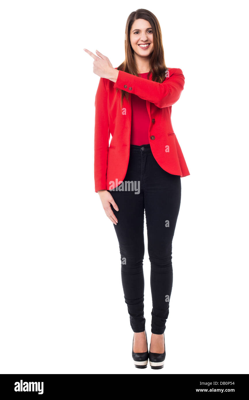 Pretty caucasian woman pointing backwards Stock Photo - Alamy