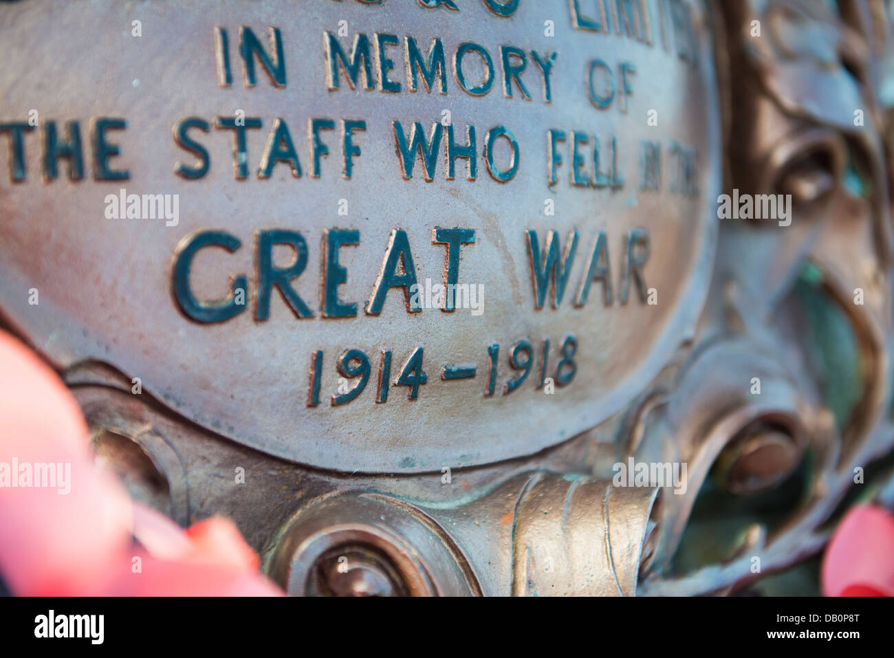 Detail of WW1 metal plaque showing the sentence In Memory Of The Staff ...