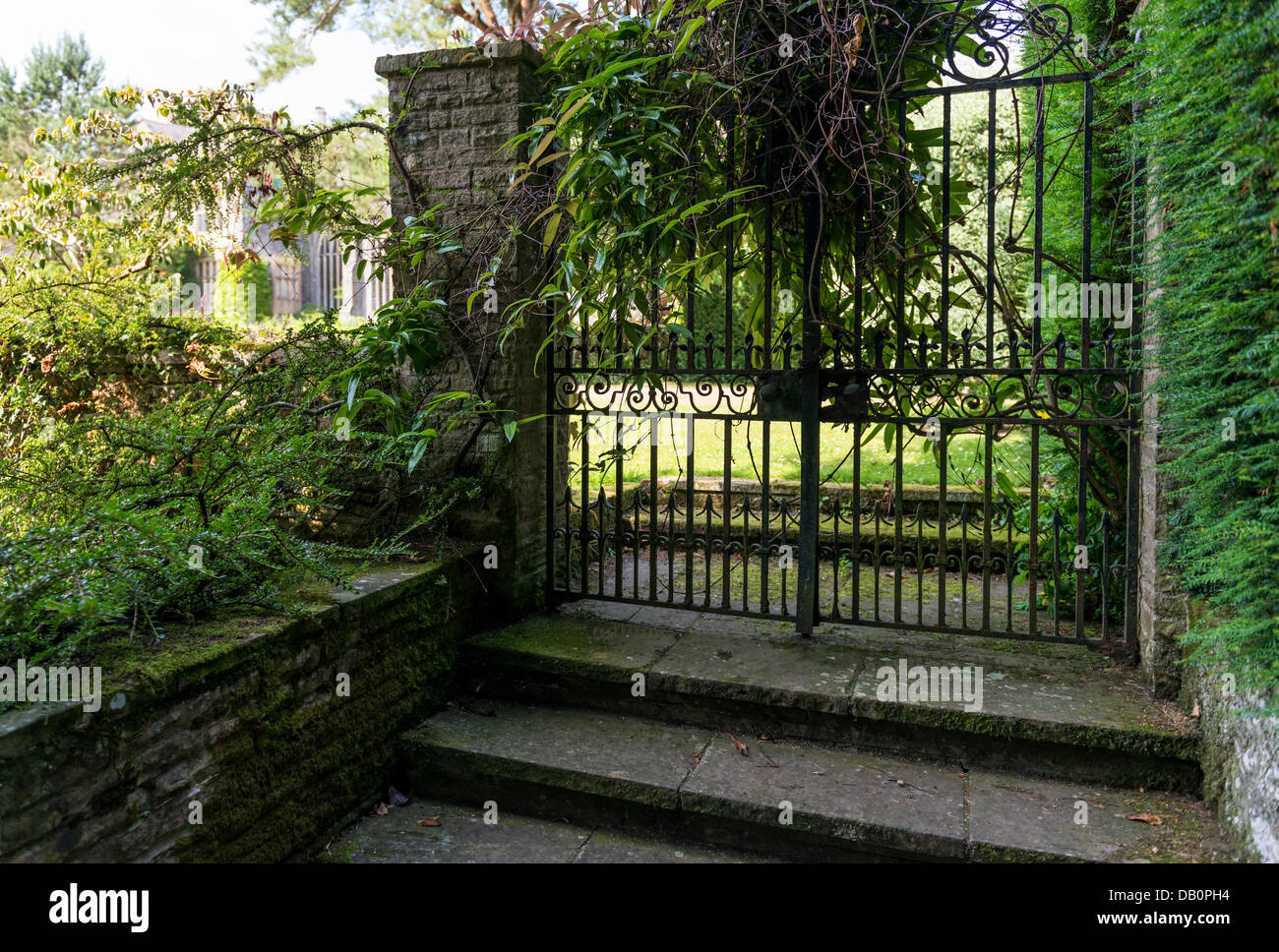 Dartington, Devon, England. July 15th 2013. Old wrought iron gates at ...