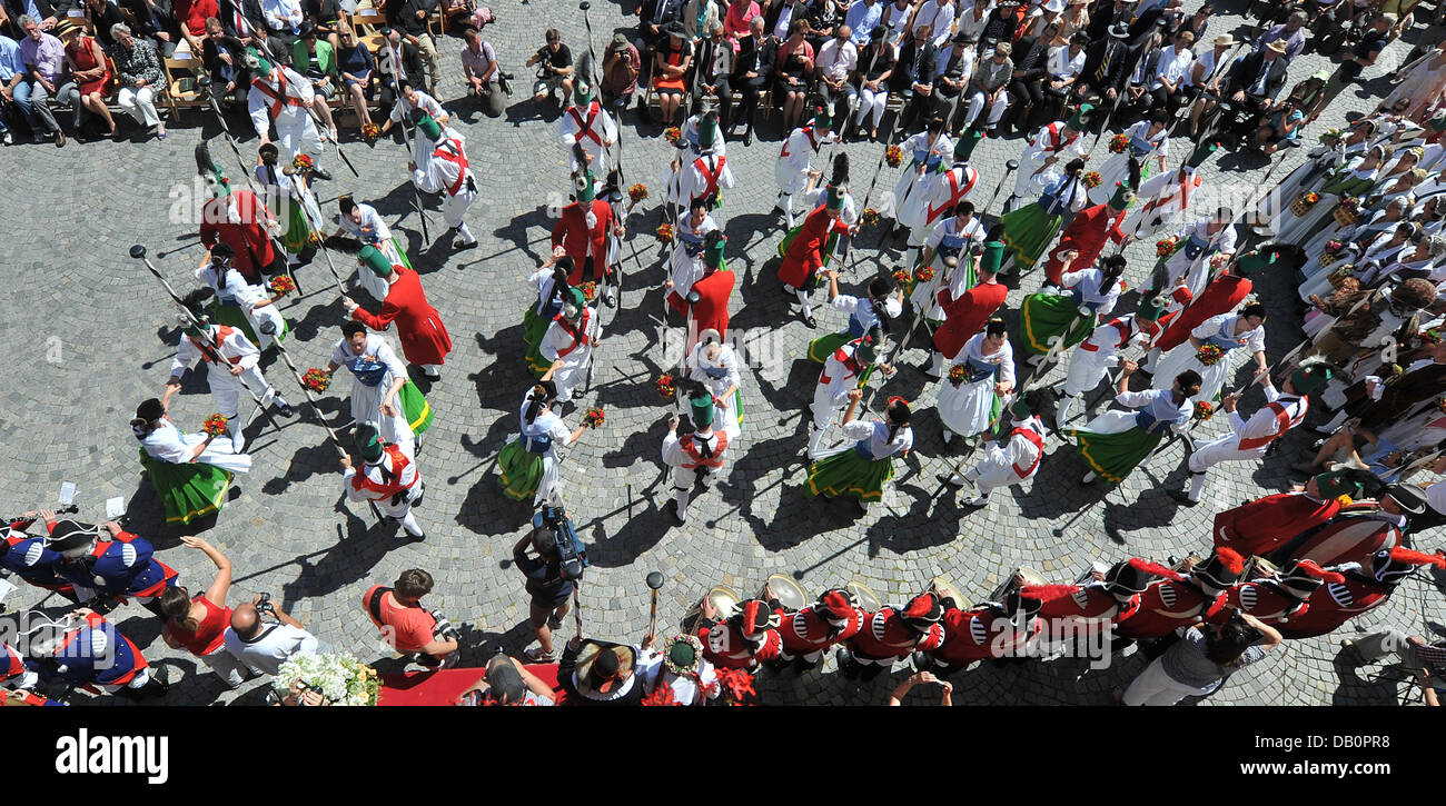 Dancers in historical costumes perform the fisher dance in Ulm, Germany ...