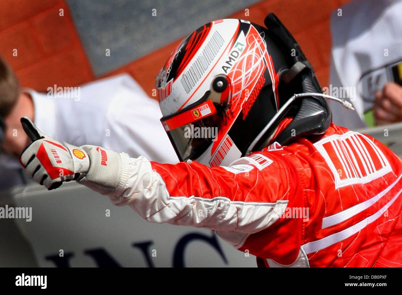 Finnish Formula One driver Kimi Raikkonen of Ferrari makes a thumbs up ...