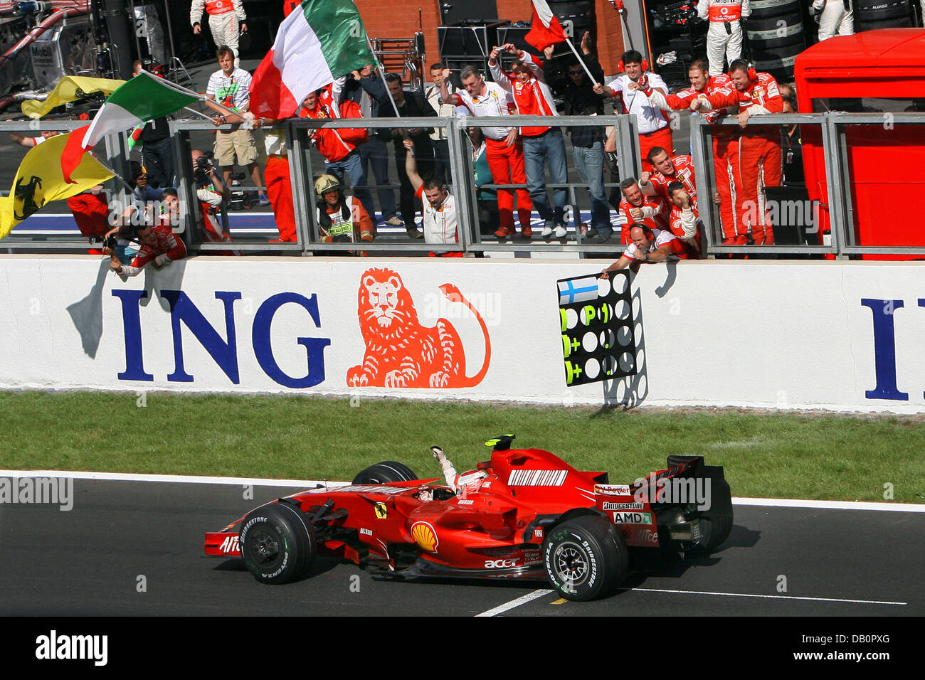Finnish Formula One driver Kimi Raikkonen of Ferrari crosses the finish ...
