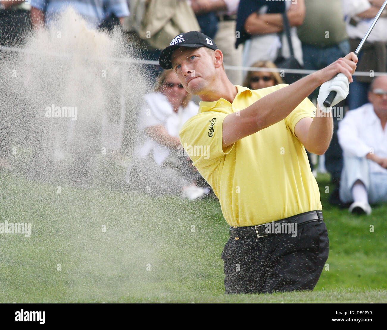 Danish golfer Soeren Hansen frees the ball from a sand trap during the ...