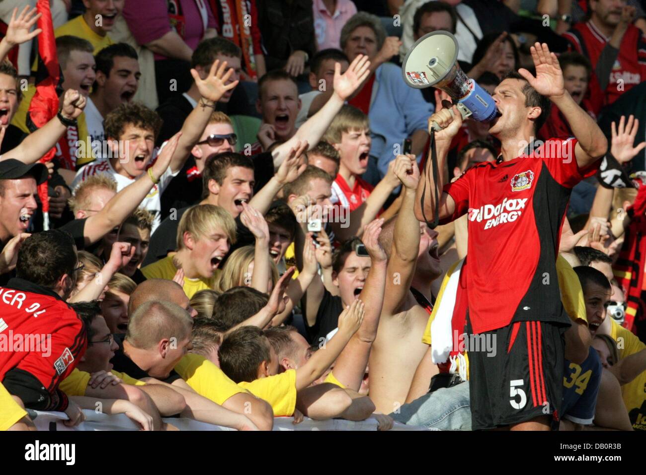 Manuel Friedrich of Bayer Leverkusen celebrates with fans after his ...
