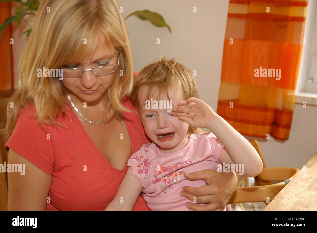 Veronika Ott comforts her crying daughter Annika at their home in ...