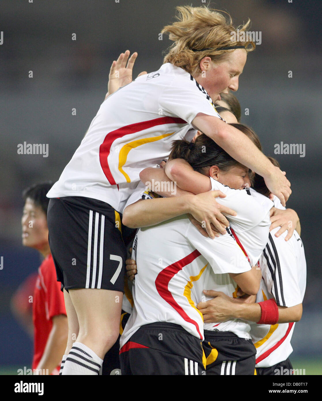 Germany's Melanie Behringer (top) and her teammates cheer after Renate ...