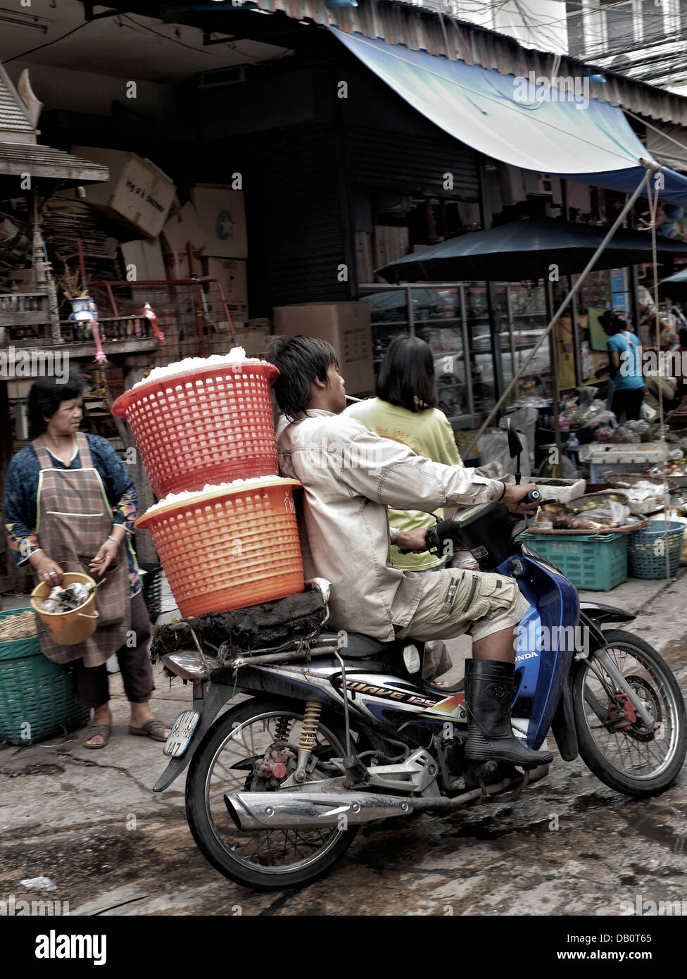 Thailand motorbike delivery. Ice delivery boy with motorcycle speeding ...