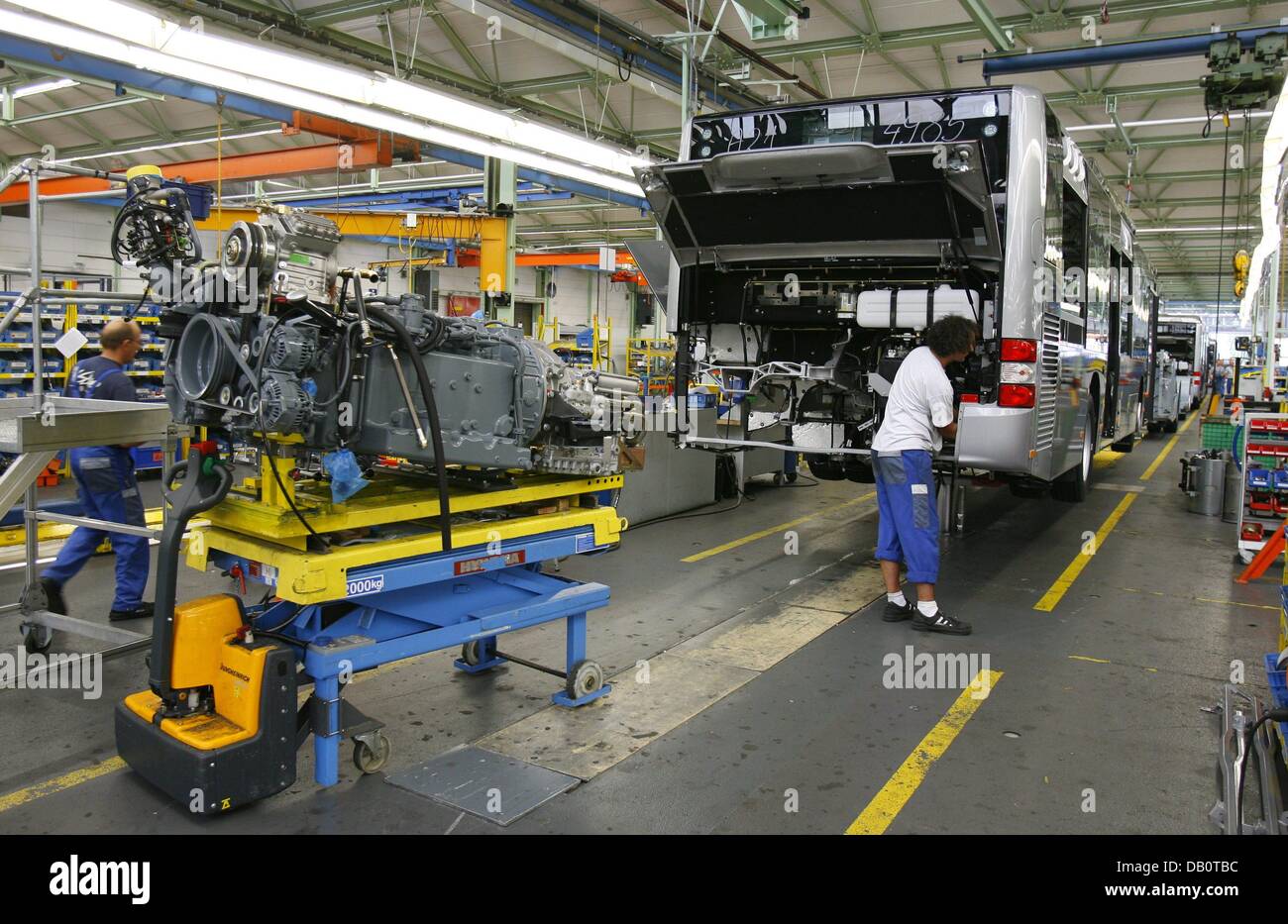 A worker assembles a bus at the MAN manufacturing plant in Salzgitter ...