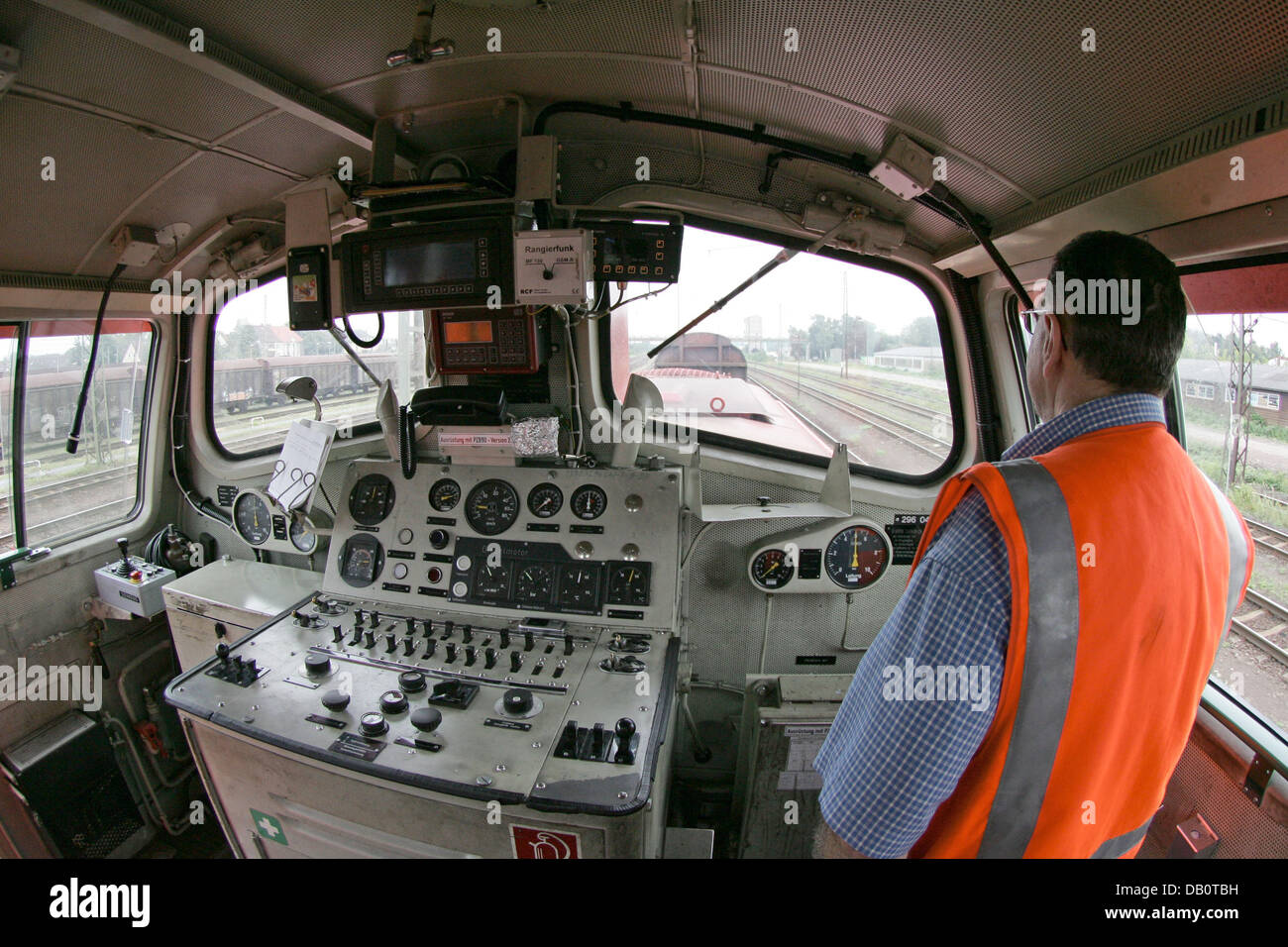 A engine driver steers a locomotive at the marshalling yard in Seelze ...