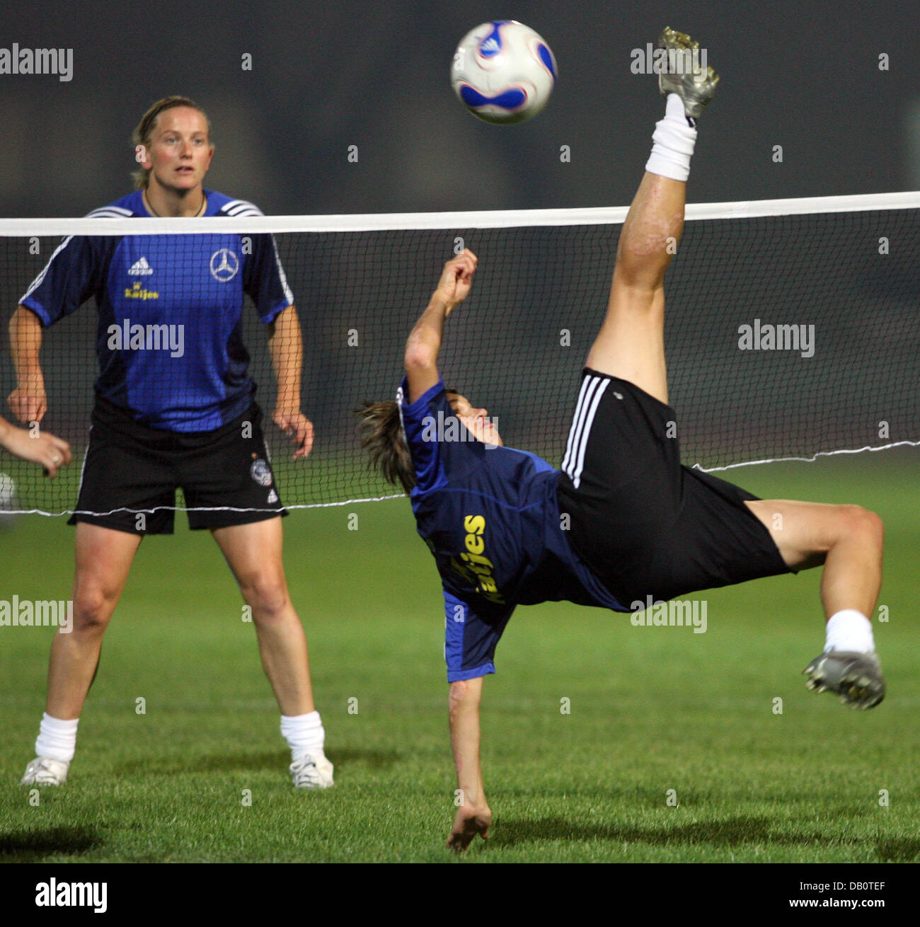 German national players Ariane Hingst (R) and Kerstin Stegemann play ...