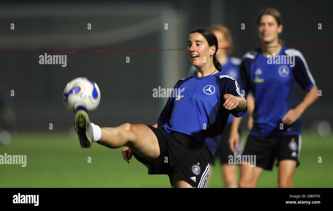 German national player Birgit Prinz (L) is pictured in action during ...