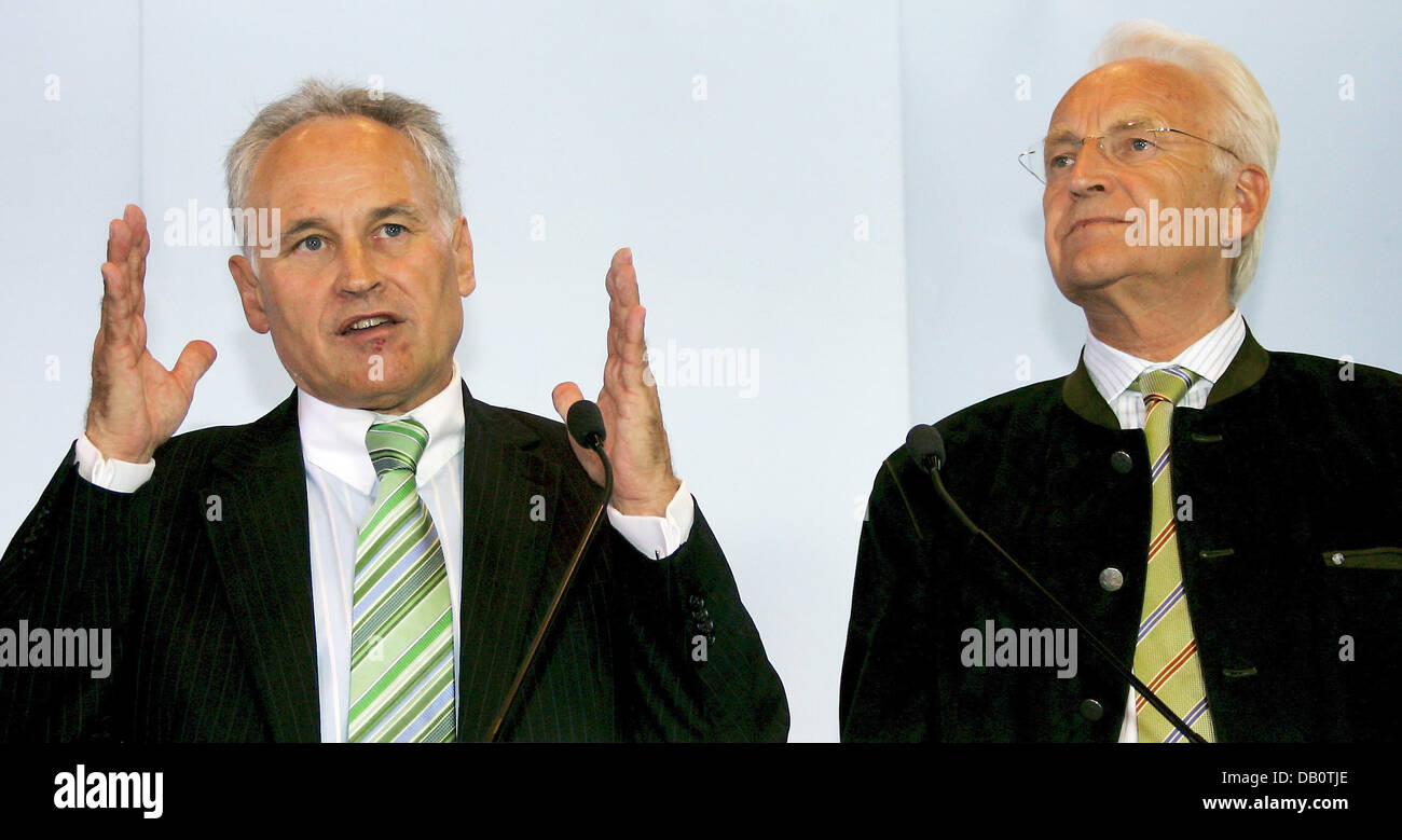 Outgoing Bavarian Prime Minister Edmund Stoiber (R) and Bavarian ...