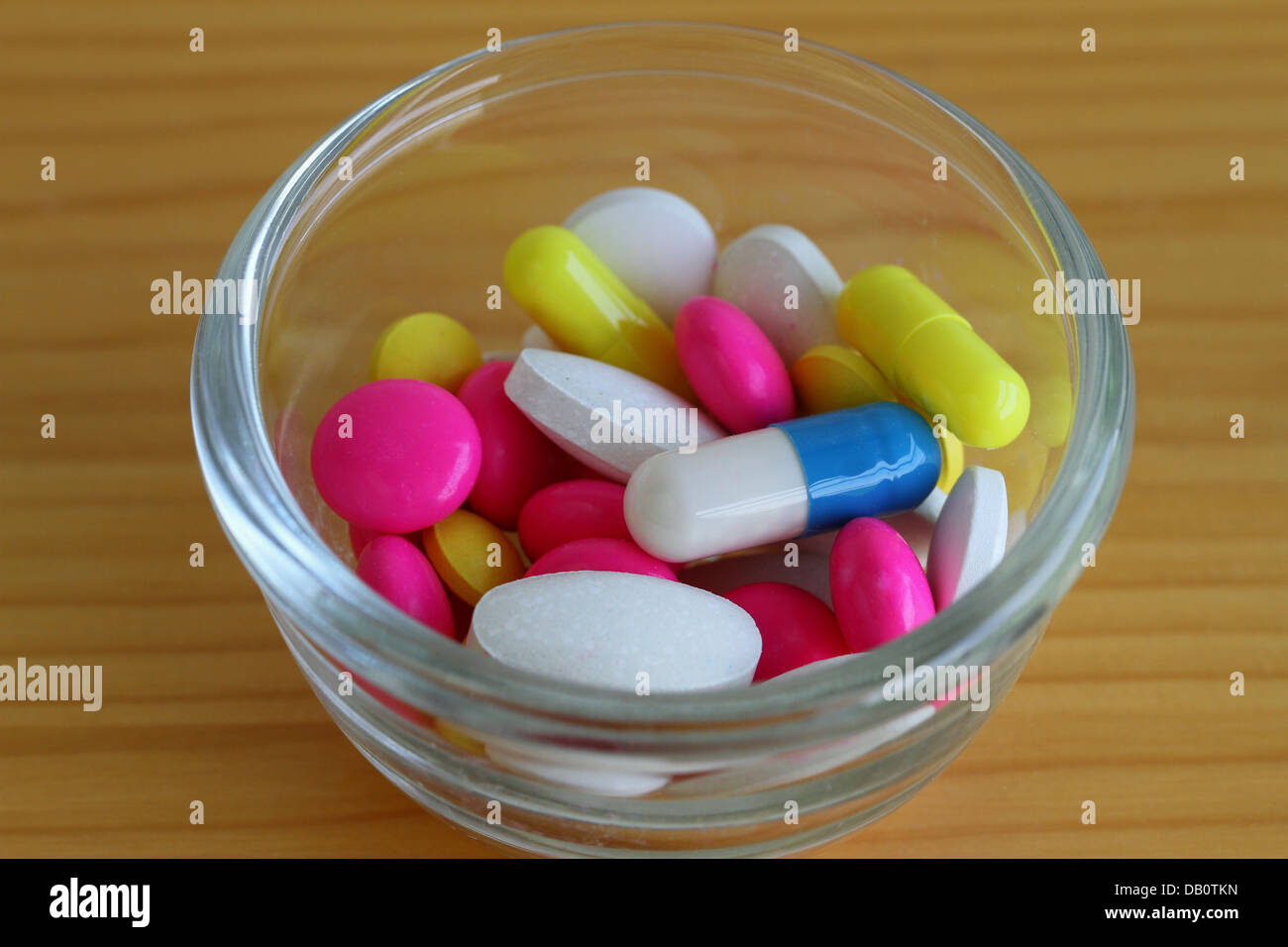 Colorful pills in glass bowl Stock Photo - Alamy