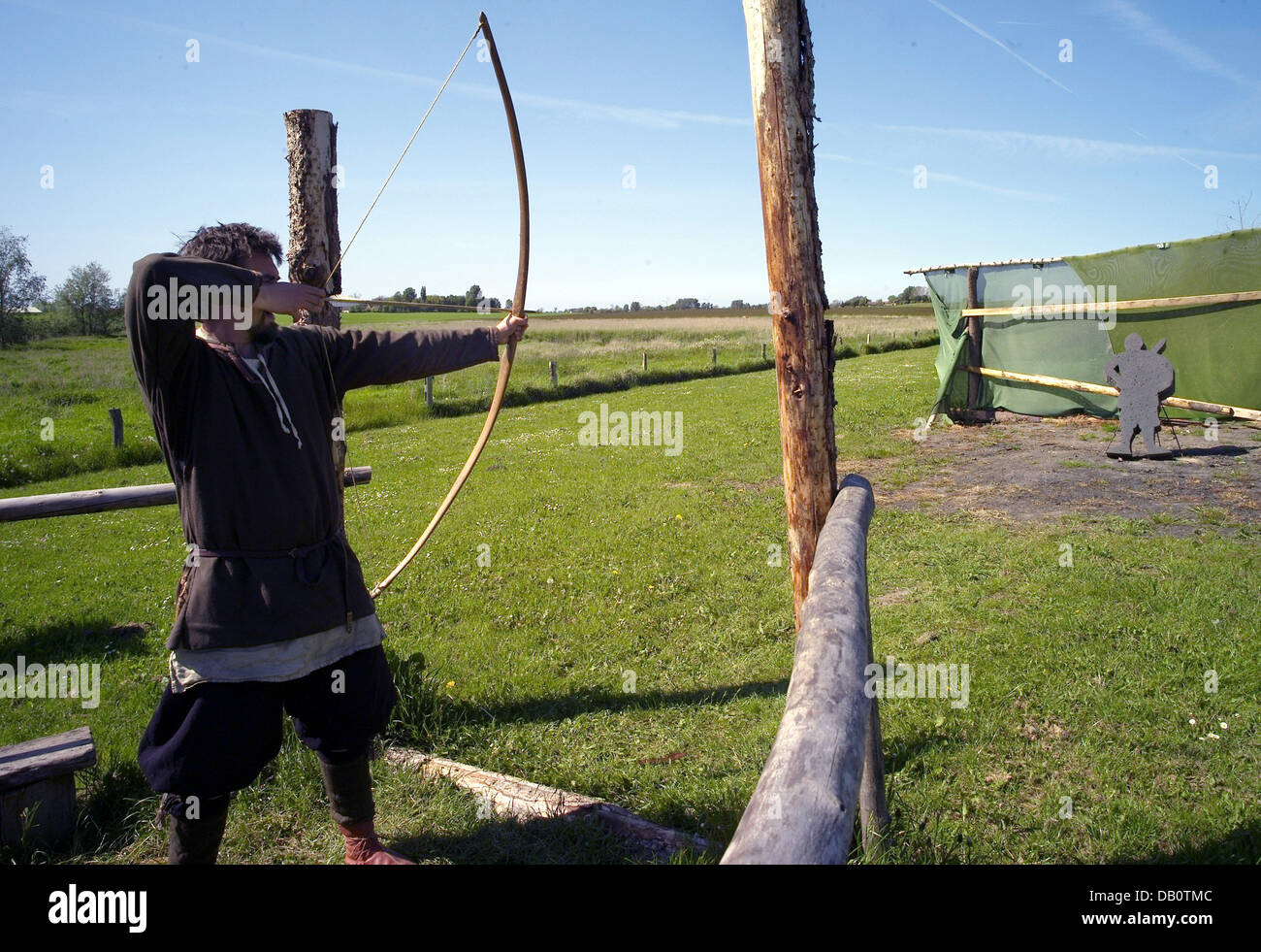 A guide in traditional Viking demonstrates the art of archery at the ...