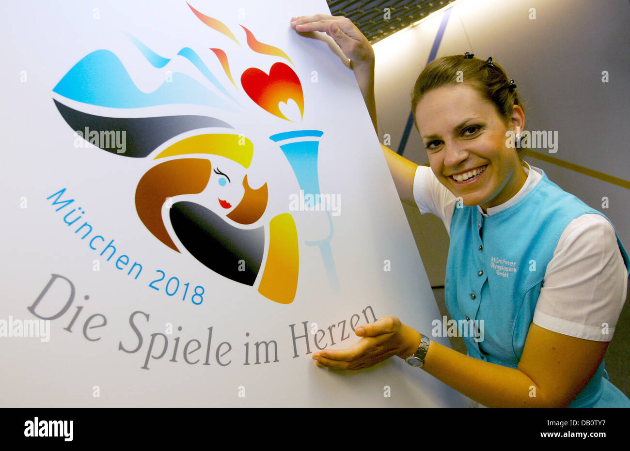 A model poses with a logo of the Olympic Games 2018 cadidacy of Munich, Germany, 08 August 2007 ...