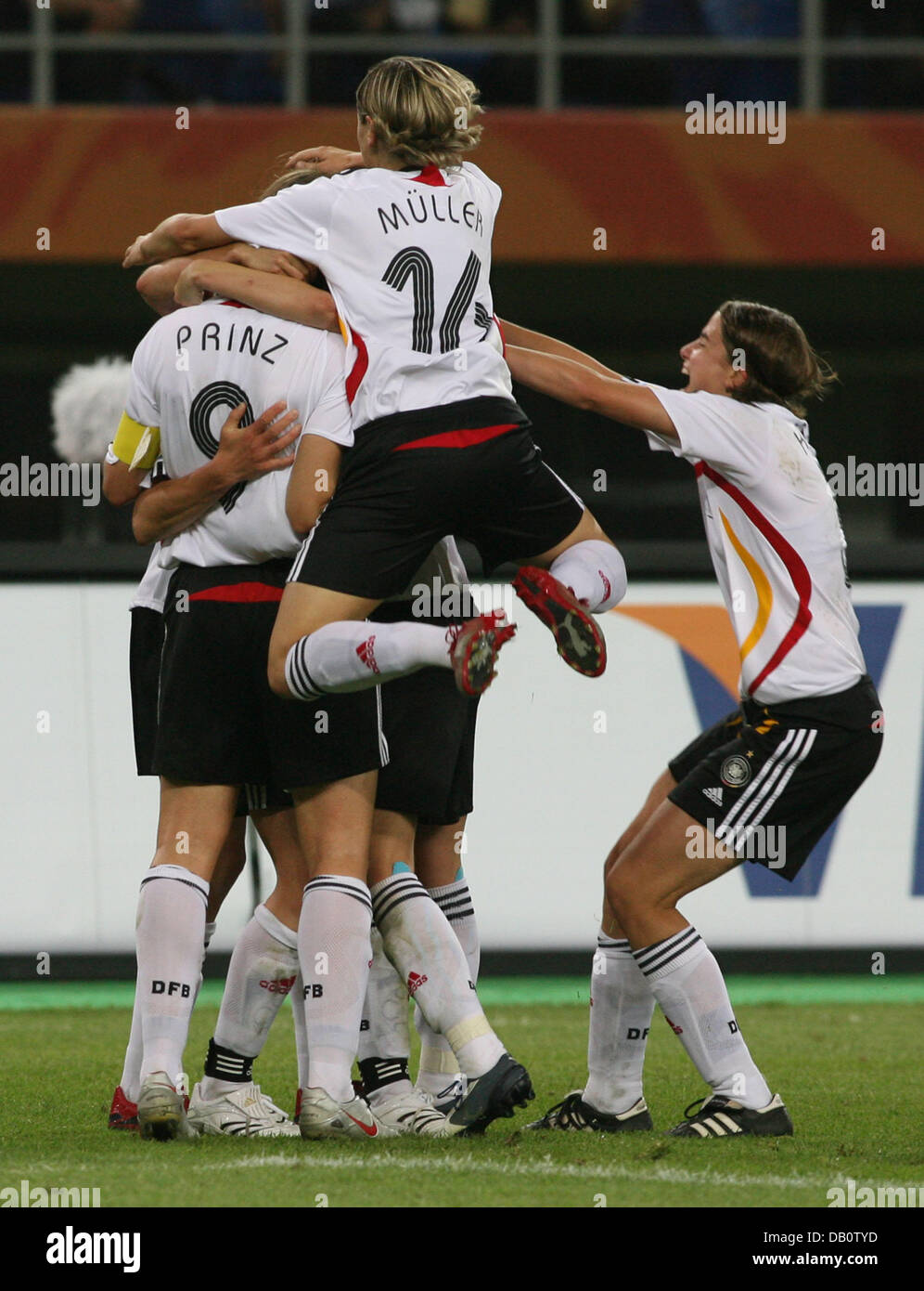 Germany's Birgit Prinz (L), Martina Mueller (C) and Annike Krahn (R ...